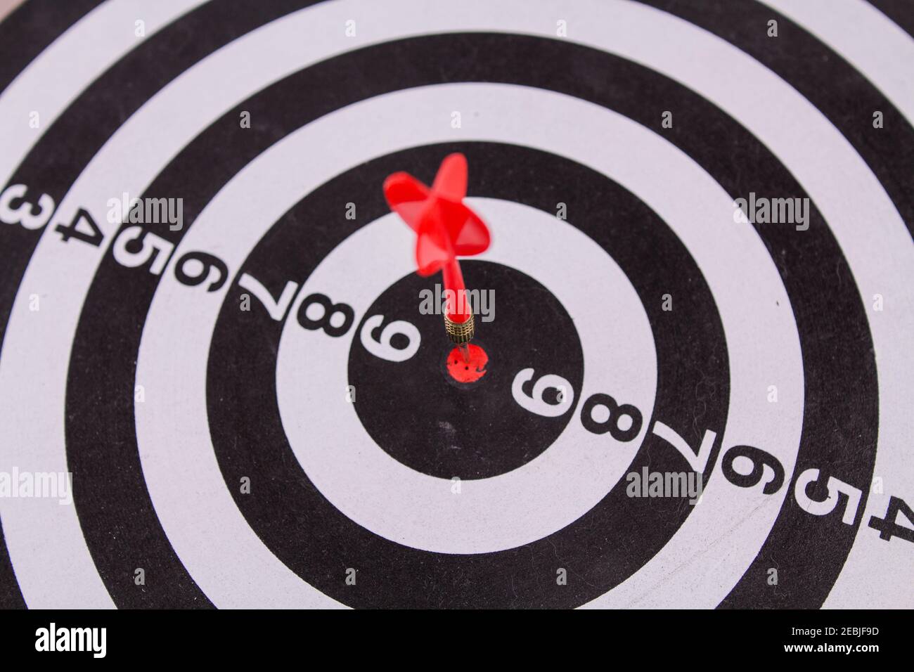 a red dart darts in the center of the target hit the target won Stock ...