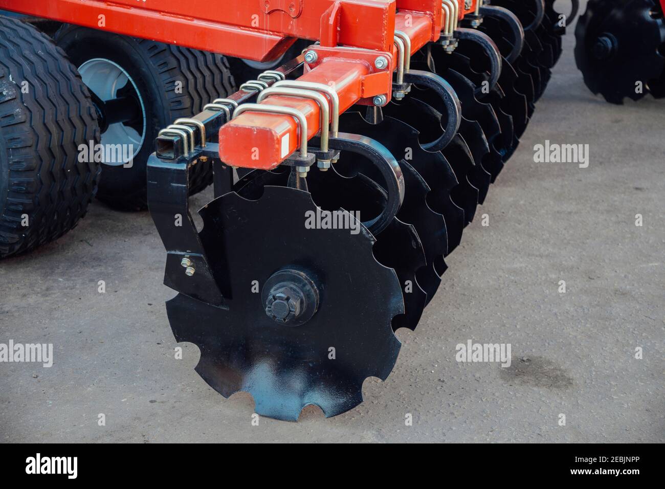 New modern agricultural disc harrow for tillage Stock Photo - Alamy