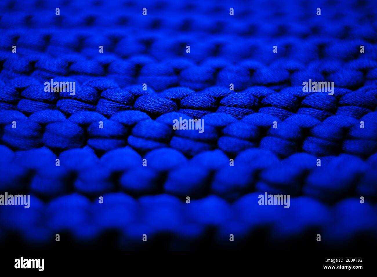 ultramarine blue background large knitted thread pattern Stock Photo ...
