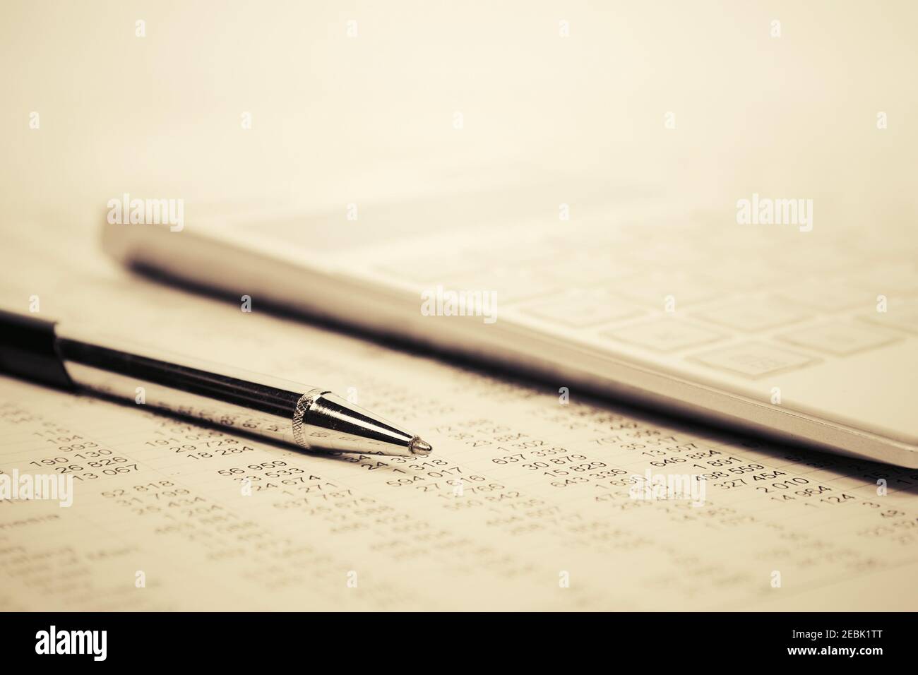 Financial accounting Pen and calculator on balance sheets Stock Photo ...