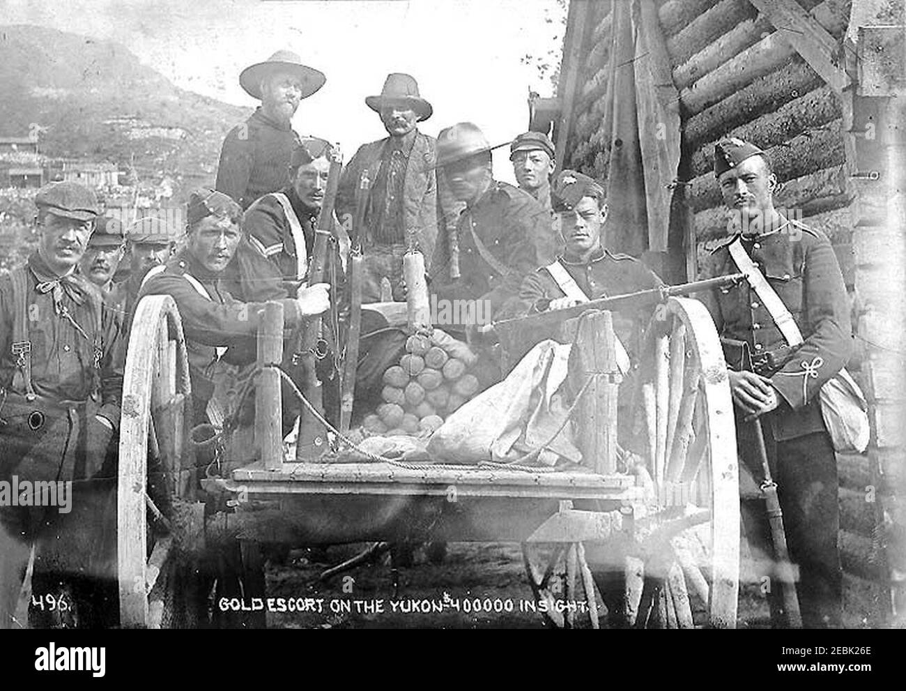 North-West Mounted Police officers carrying rifles guarding wagon ...