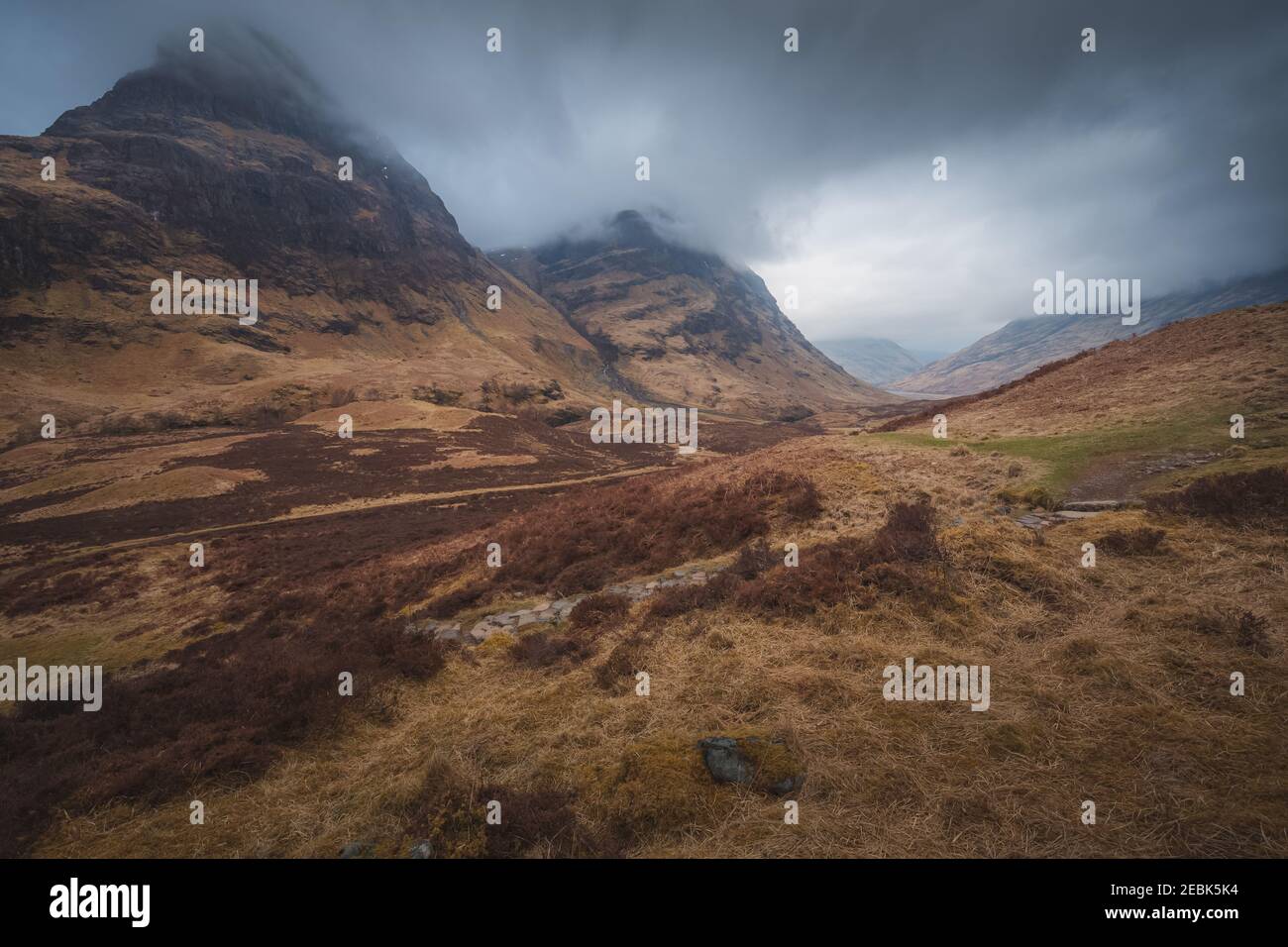 Dark and moody landscape of Glencoe in the Scottish Highlands with the ...
