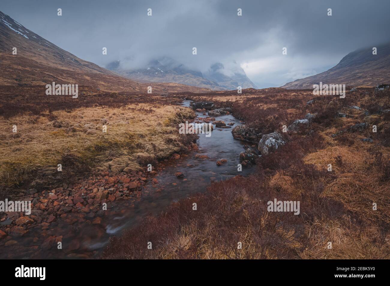 Dark and moody landscape of Glencoe in the Scottish Highlands with a ...