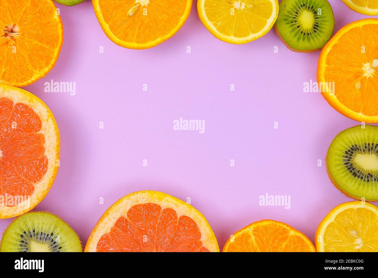 Citrus fruits background orange lemon grapefruit mandarin kiwi. Flatlay ...
