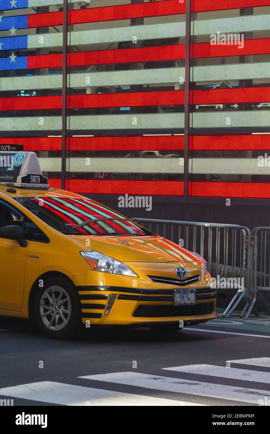 NYC Taxi Cab at a stoplight below the American Flag display on Military ...