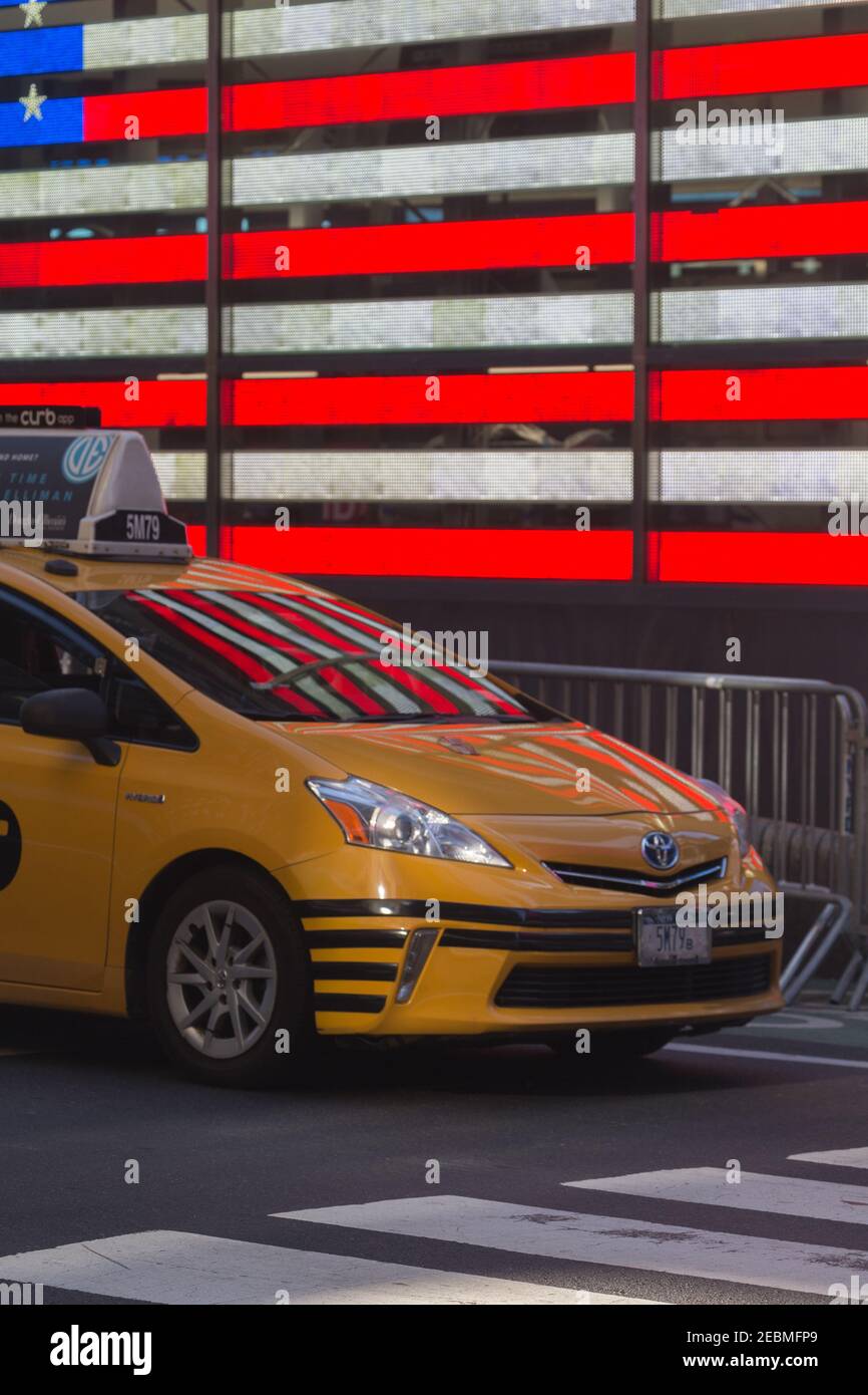 NYC Taxi Cab at a stoplight below the American Flag display on Military ...