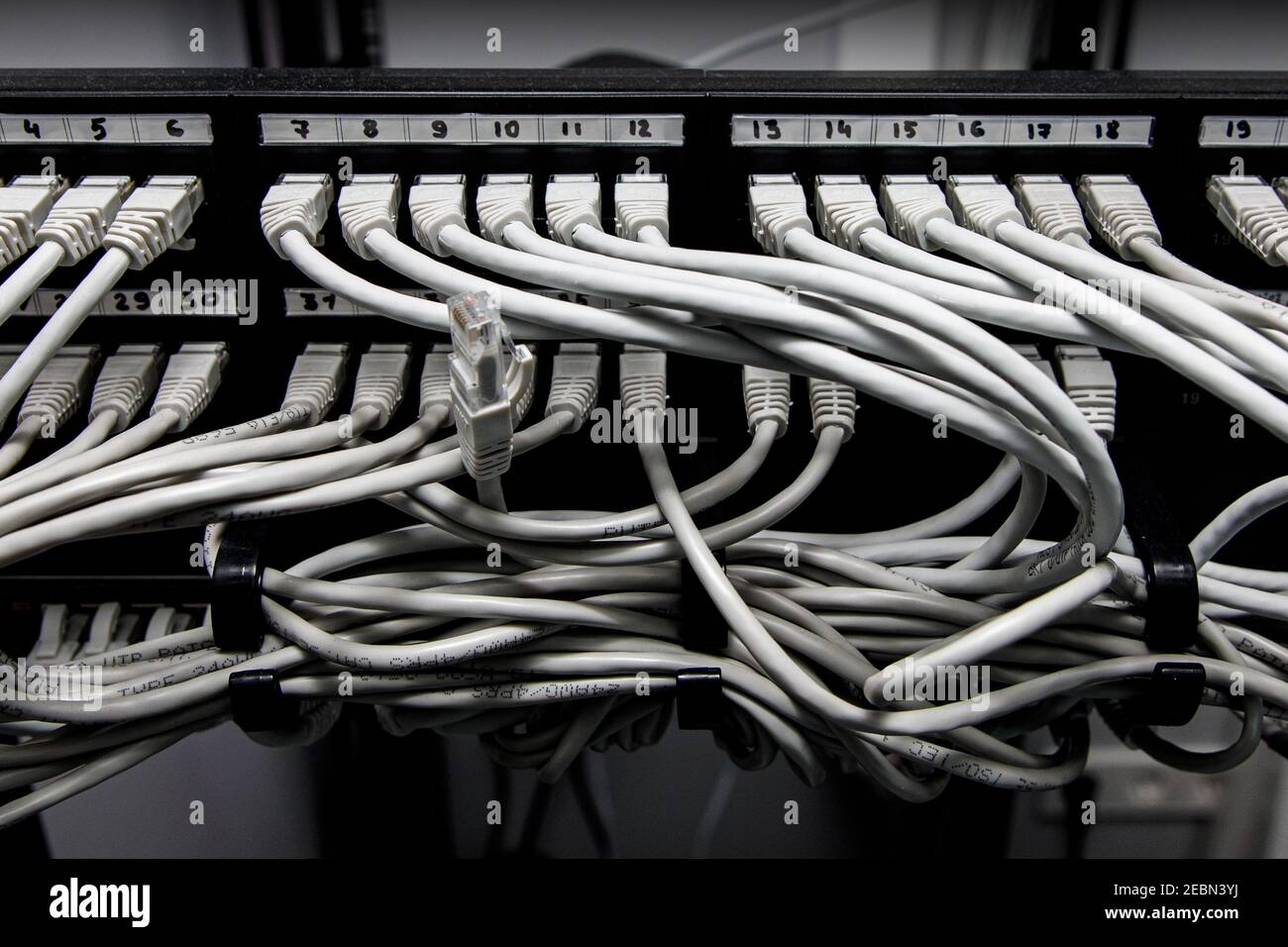 Network panel, switch and cables in data center Stock Photo - Alamy