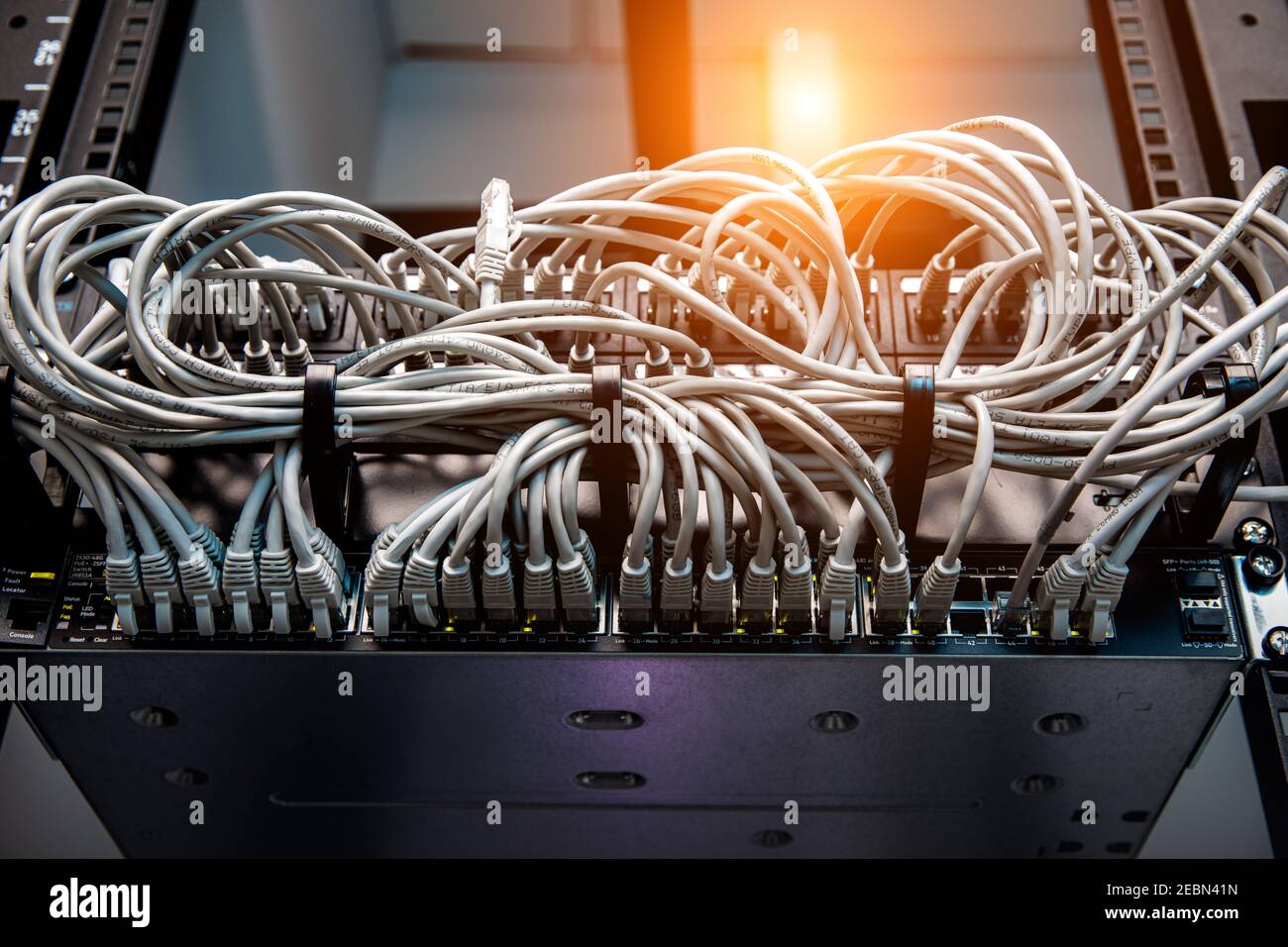 A lot of network cables connected in a big network switch Stock Photo ...