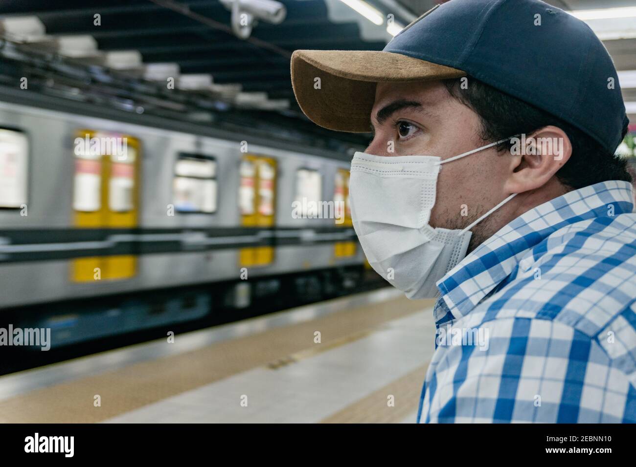 Yellow face mask on train hi-res stock photography and images - Alamy