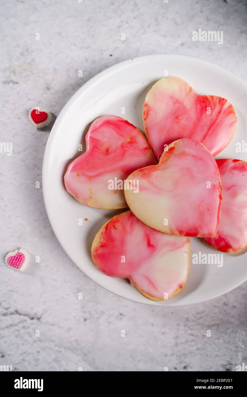 Homemade Valentine heart Sugar cookies with marble icing Stock Photo ...