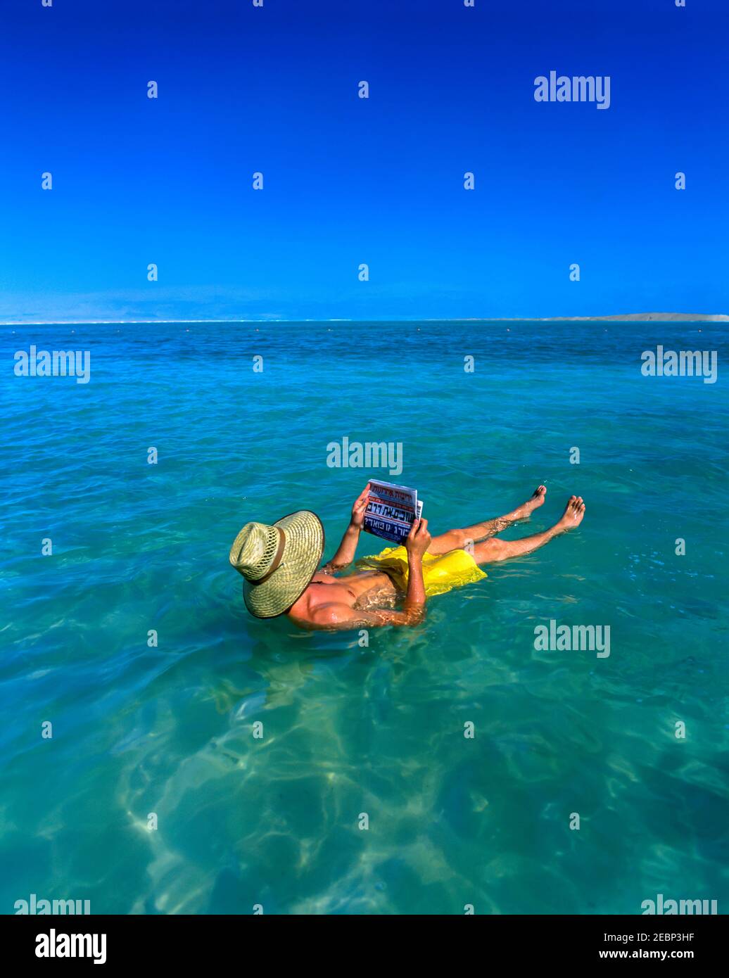 Dead sea reading newspaper floating hi-res stock photography and images ...