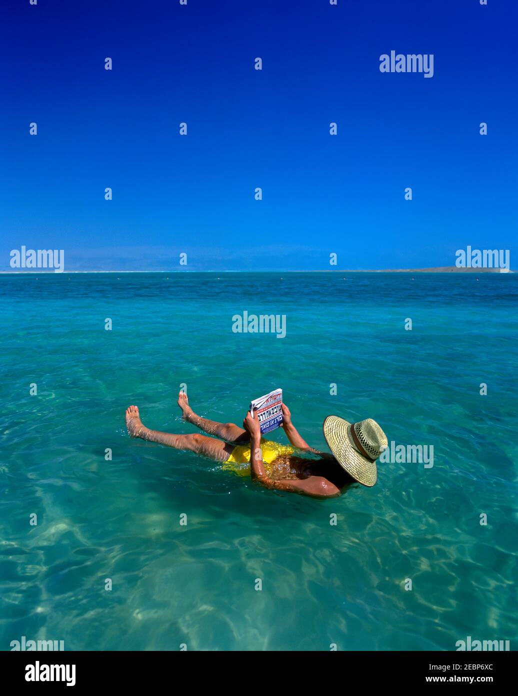 Dead sea reading newspaper floating hi-res stock photography and images ...