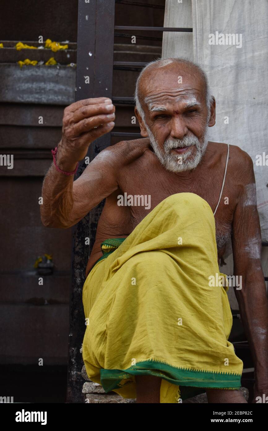 Priest sprinkling water hi-res stock photography and images - Alamy