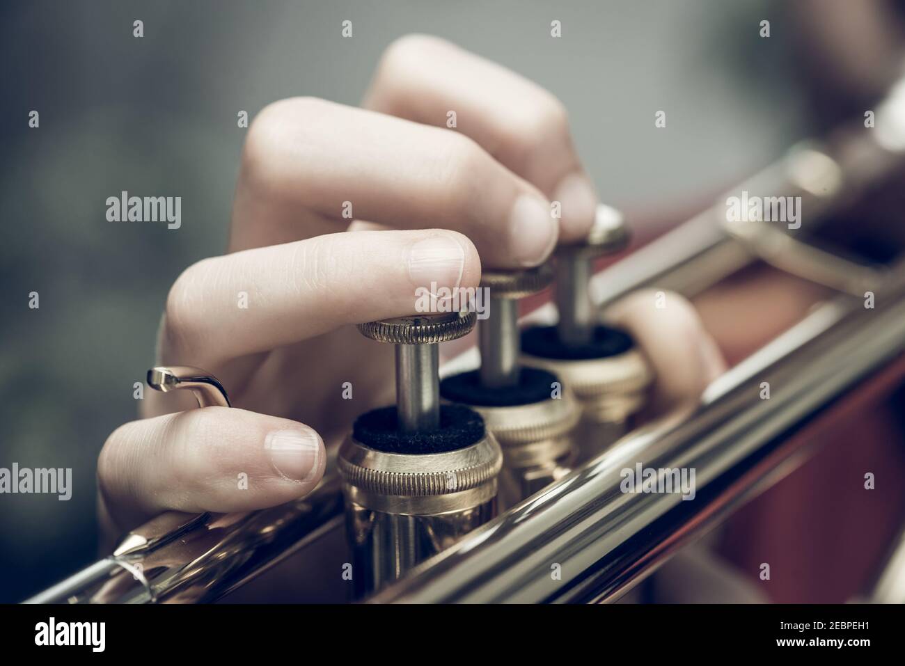 Close up of a child playing a trumpet Stock Photo - Alamy