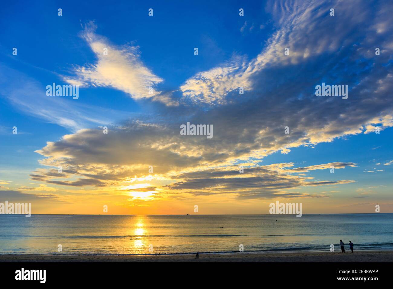 Beautiful sunset over the clam sea with cloud and sky background ...