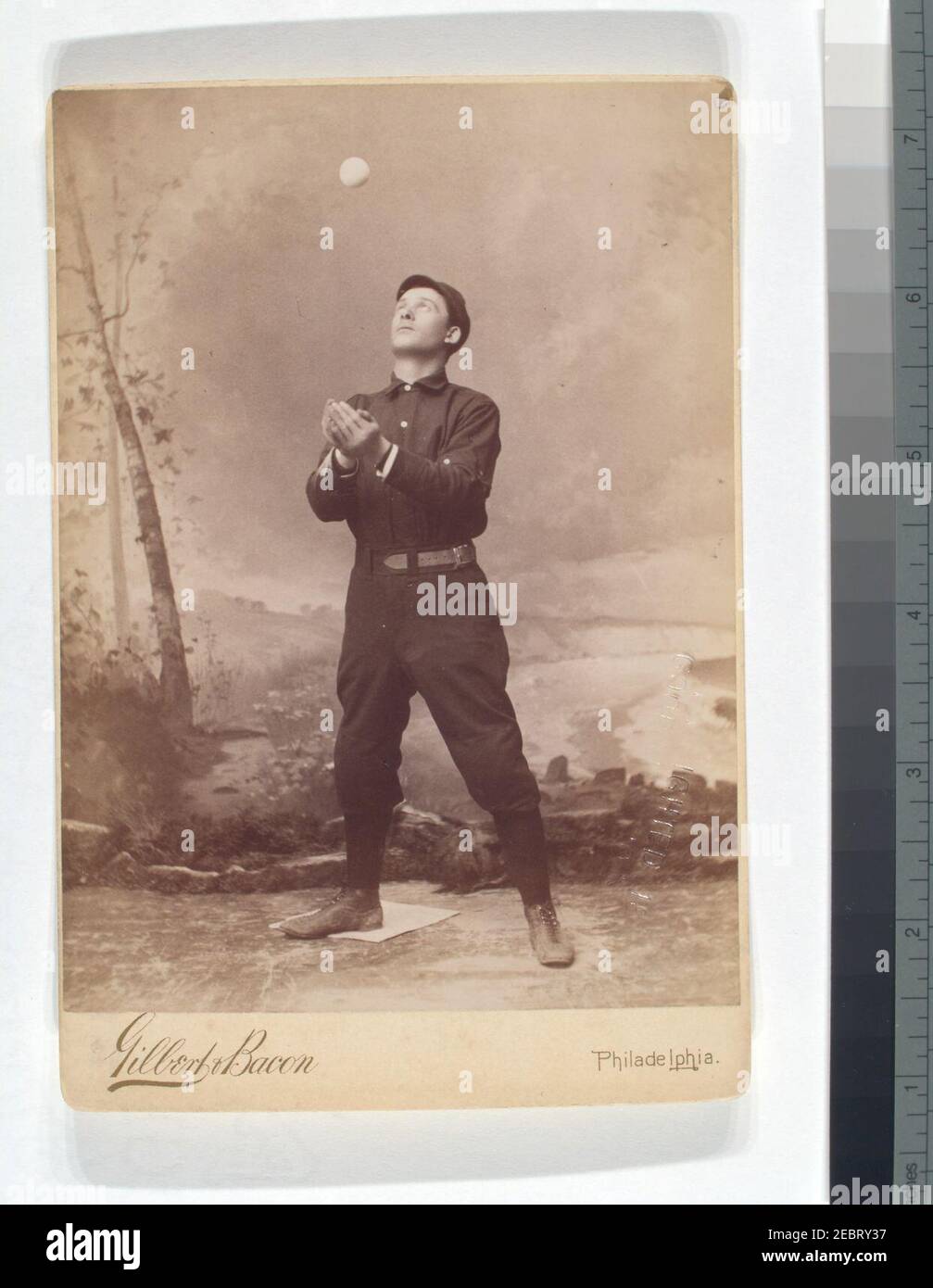 Unidentified baseball player in dark uniform - catching form Stock ...