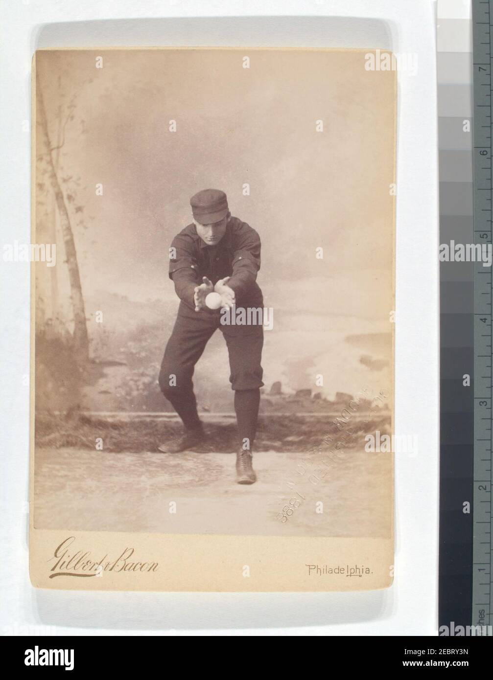 Unidentified baseball player in dark uniform - catching form Stock ...