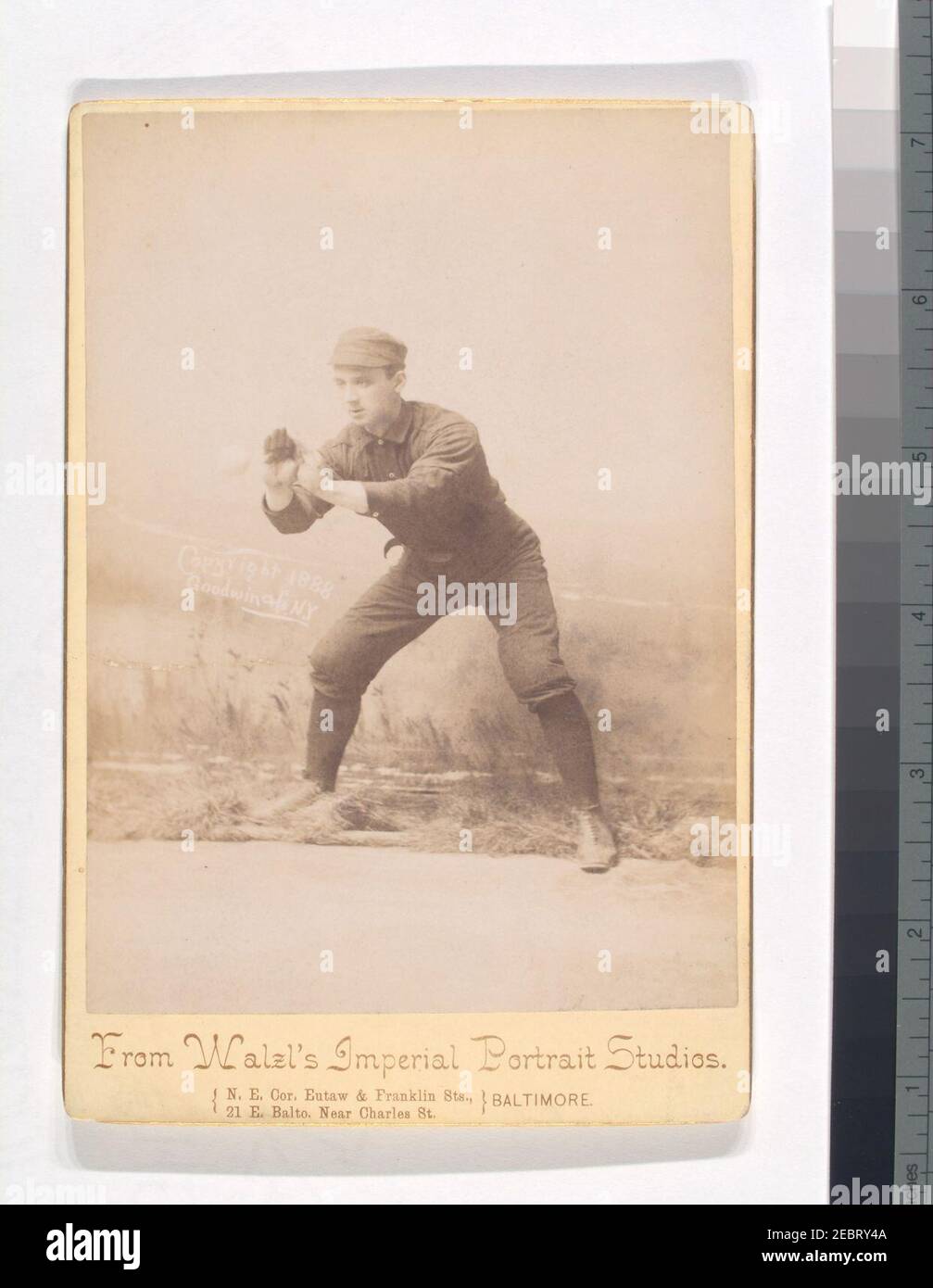 Unidentified baseball player in dark uniform - catching form Stock ...