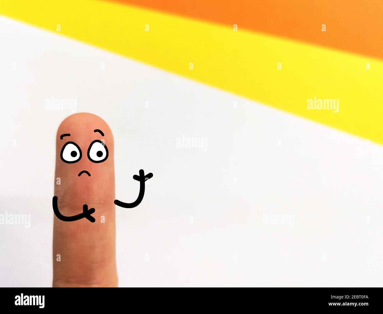 One finger is decorated as one person. He is confused and sad Stock ...
