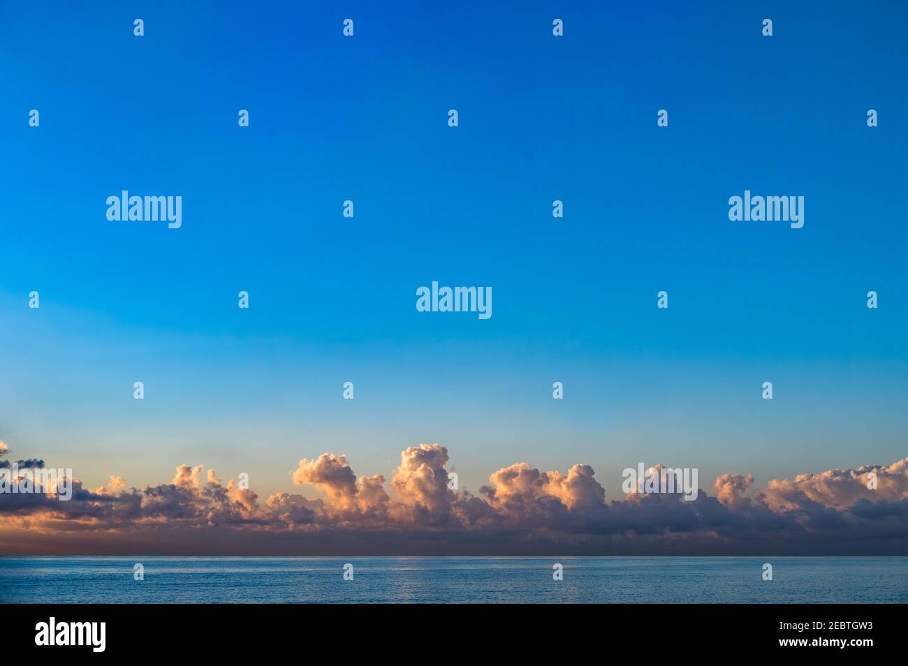 Blue sunset sky over sea Stock Photo - Alamy