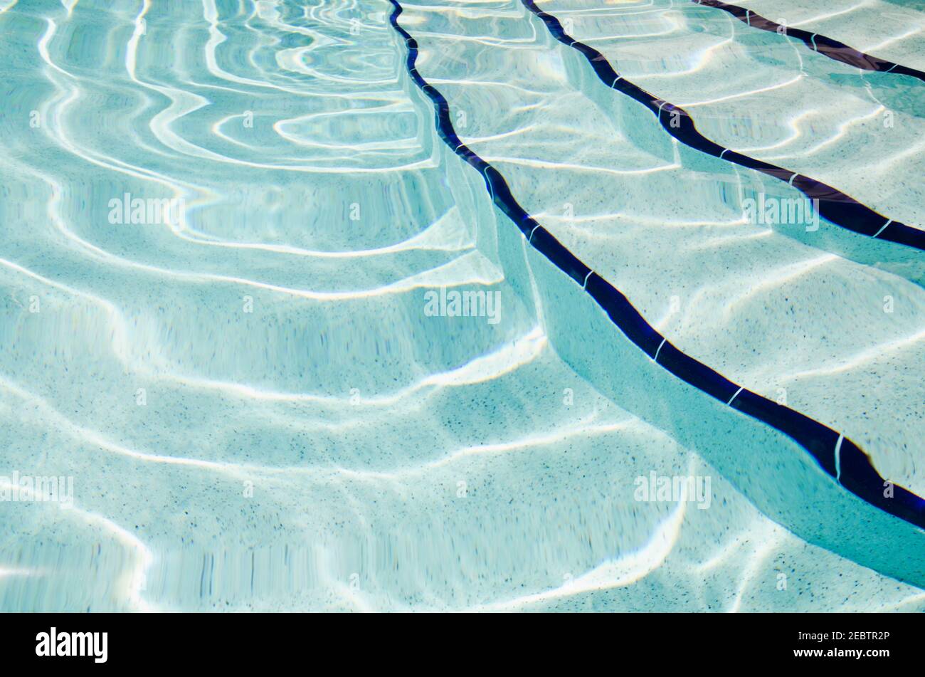 Stairs at edge of swimming pool Stock Photo - Alamy
