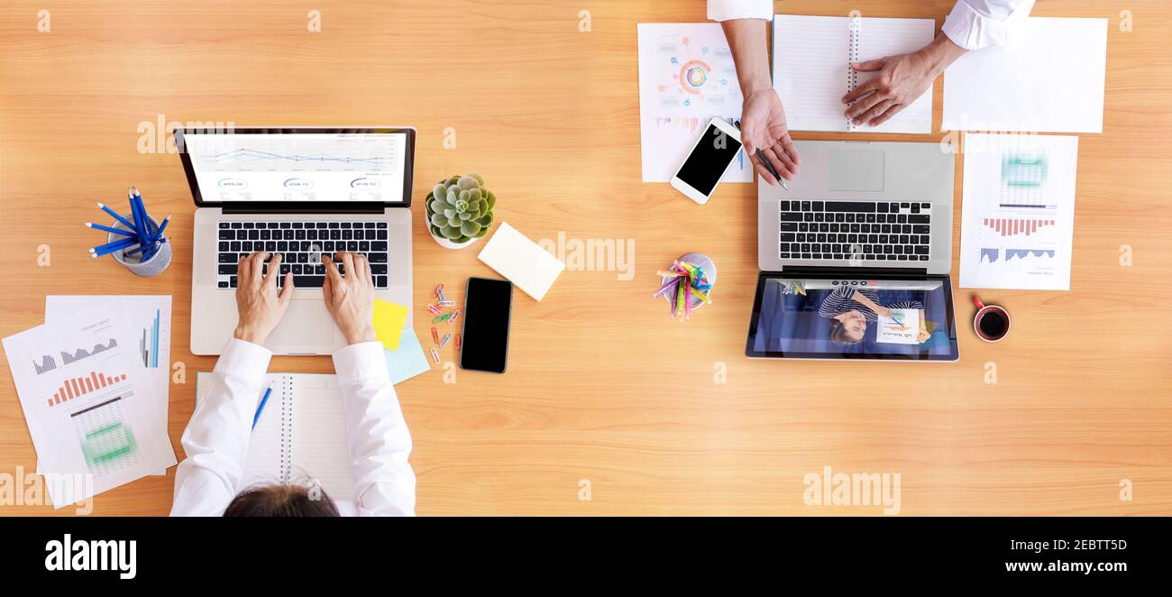 Top view Businessman and businesswoman analysis financial chart with ...