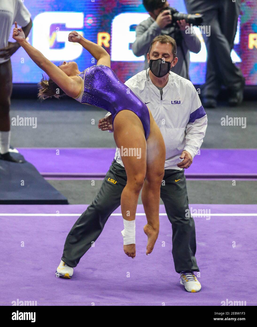 Baton Rouge, LA, USA. 22nd Jan, 2021. LSU Head Coach Jay Clark helps ...