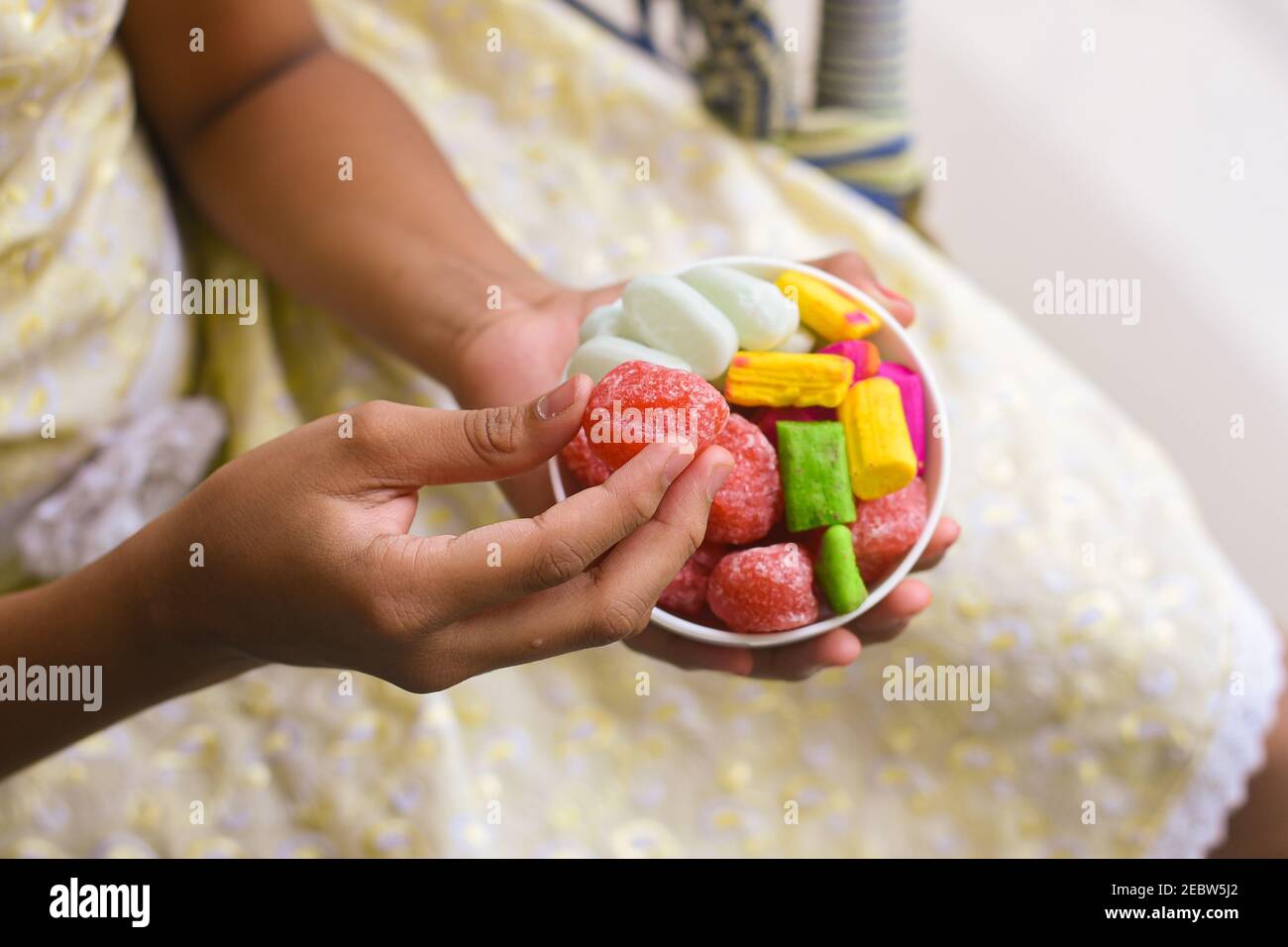 Diwali sweets eating hi-res stock photography and images - Alamy
