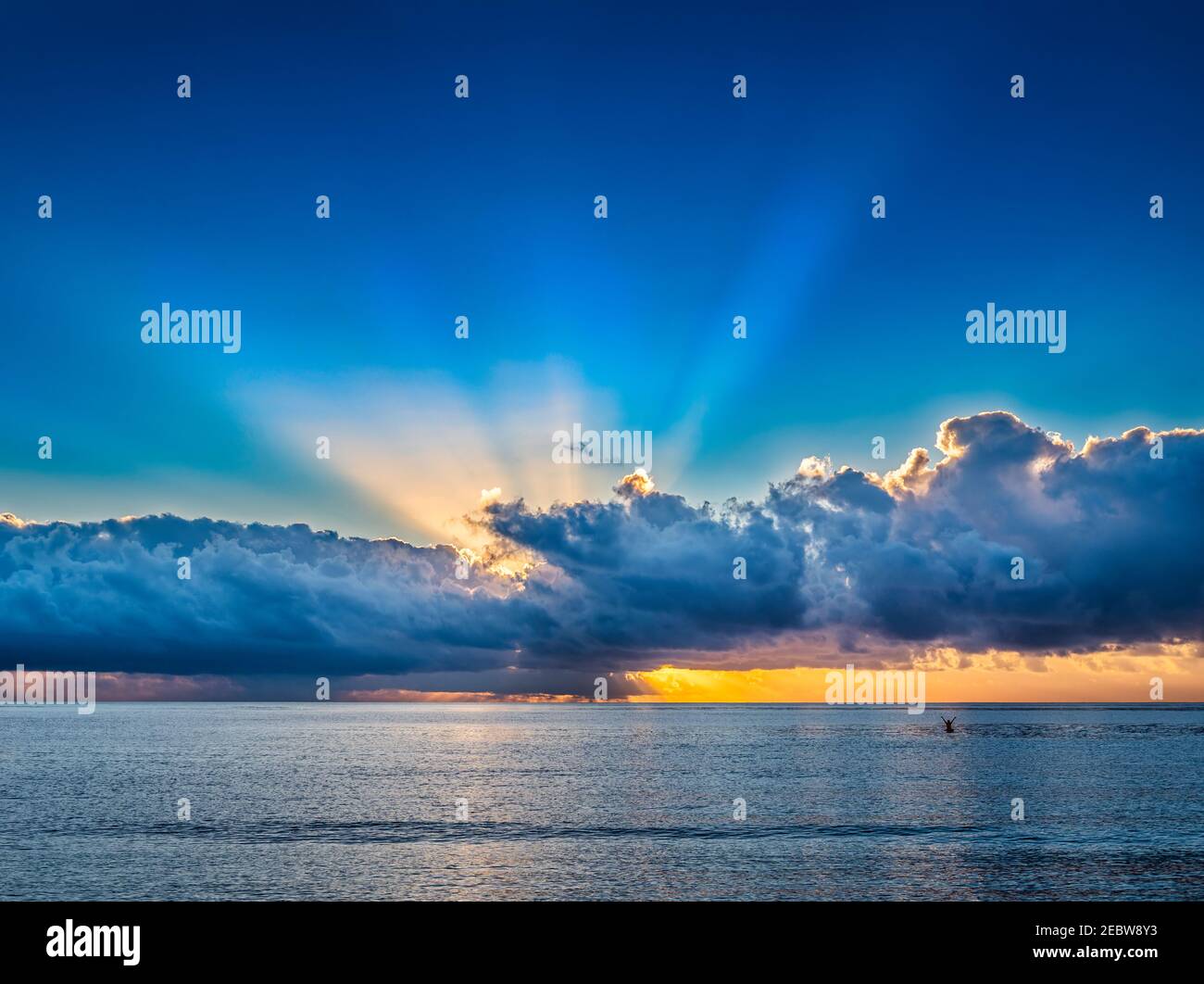 Dramatic sunset sky over sea Stock Photo - Alamy