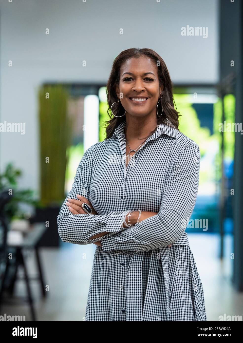 Portrait of business woman in office Stock Photo - Alamy