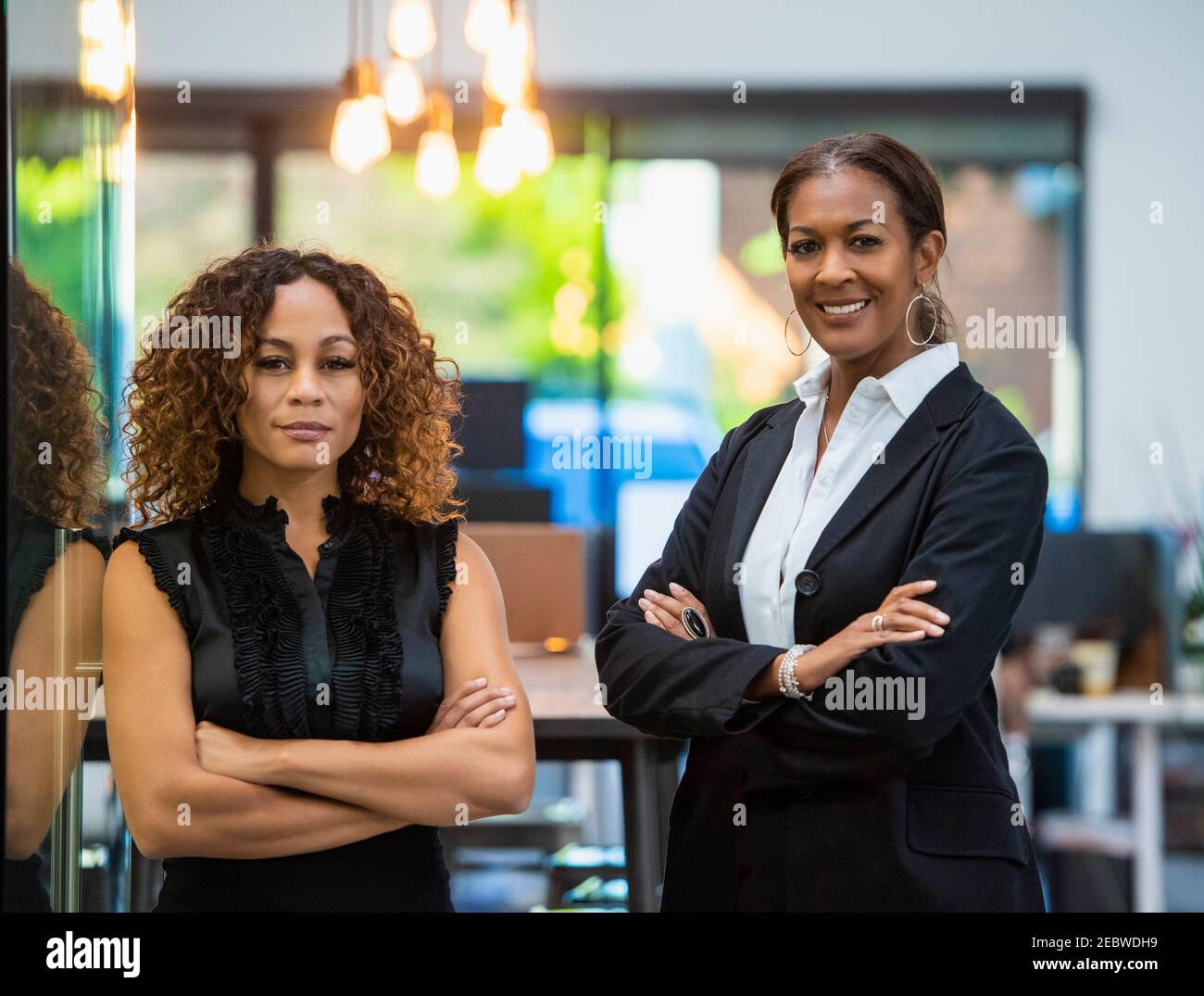 Portrait of two business women in office Stock Photo - Alamy