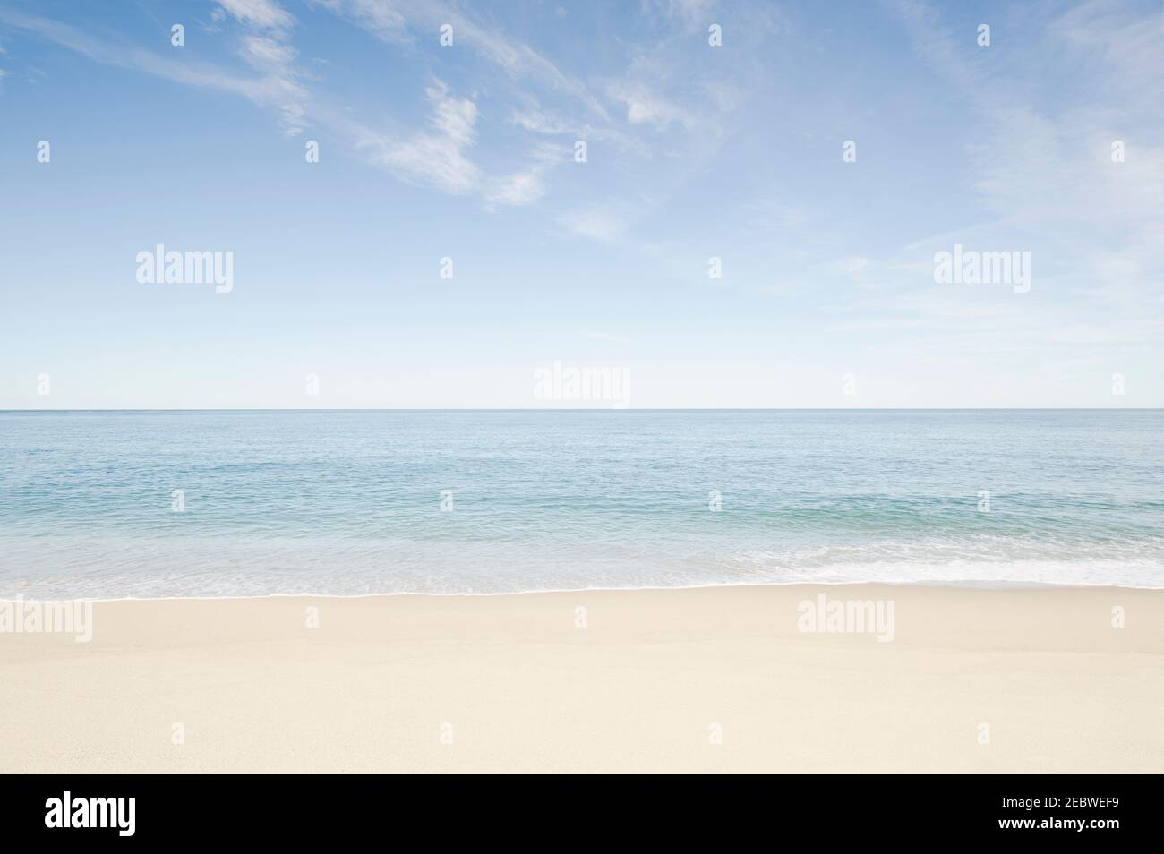 Sandy beach with ocean Stock Photo - Alamy