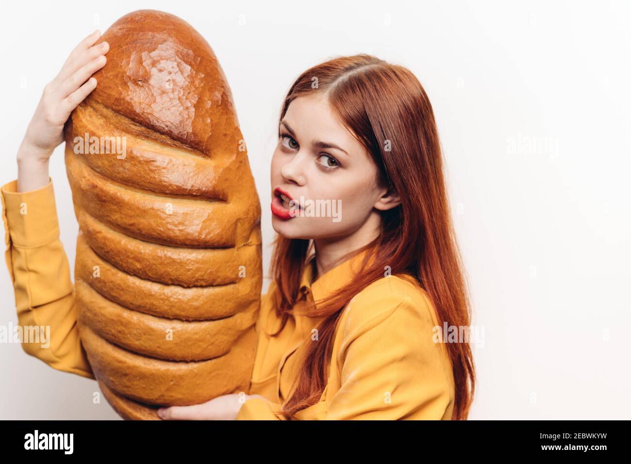 happy woman hugging loaf of bread flour product light background ...
