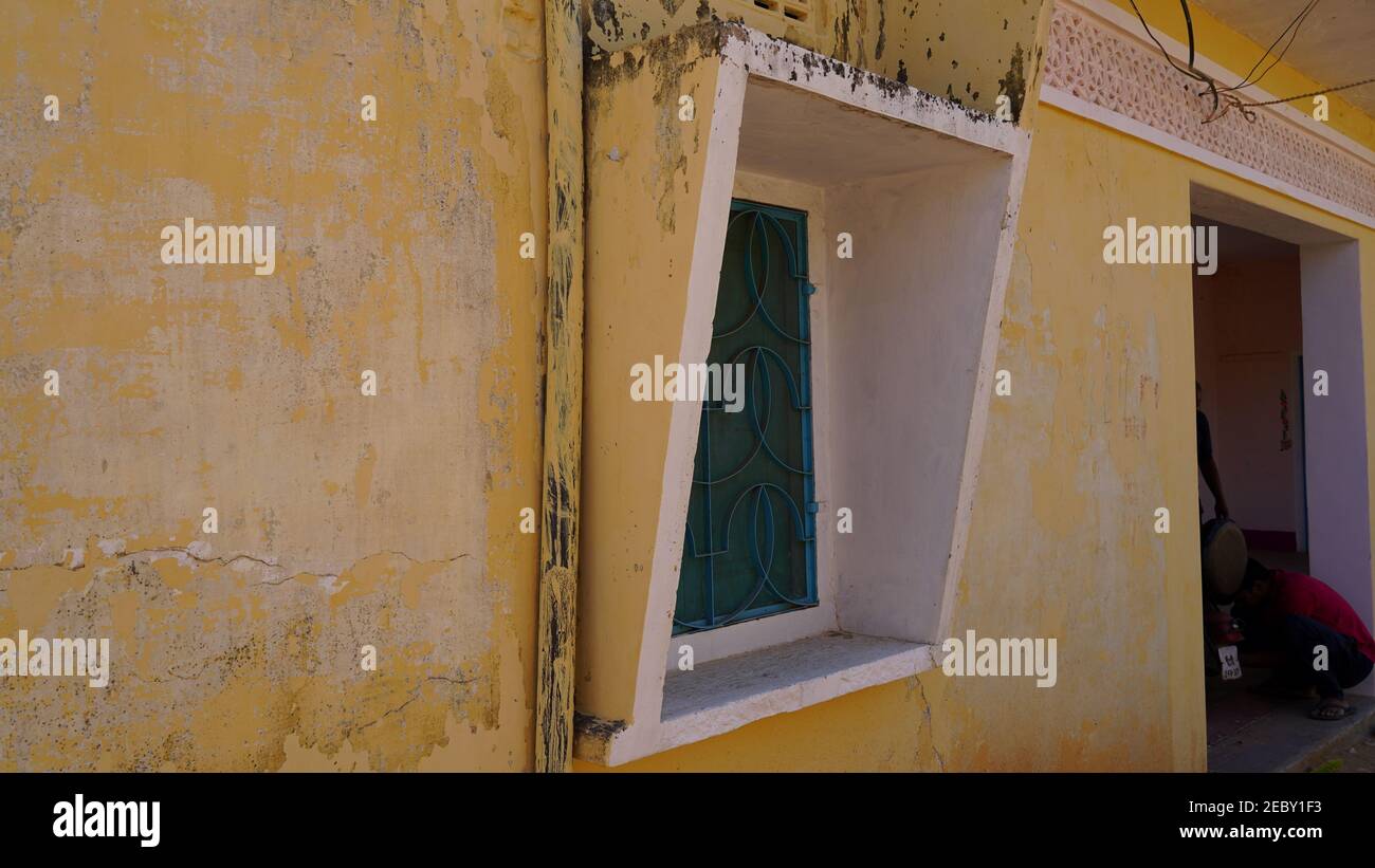 abstract old wood window on brown cement wall with stone border ...