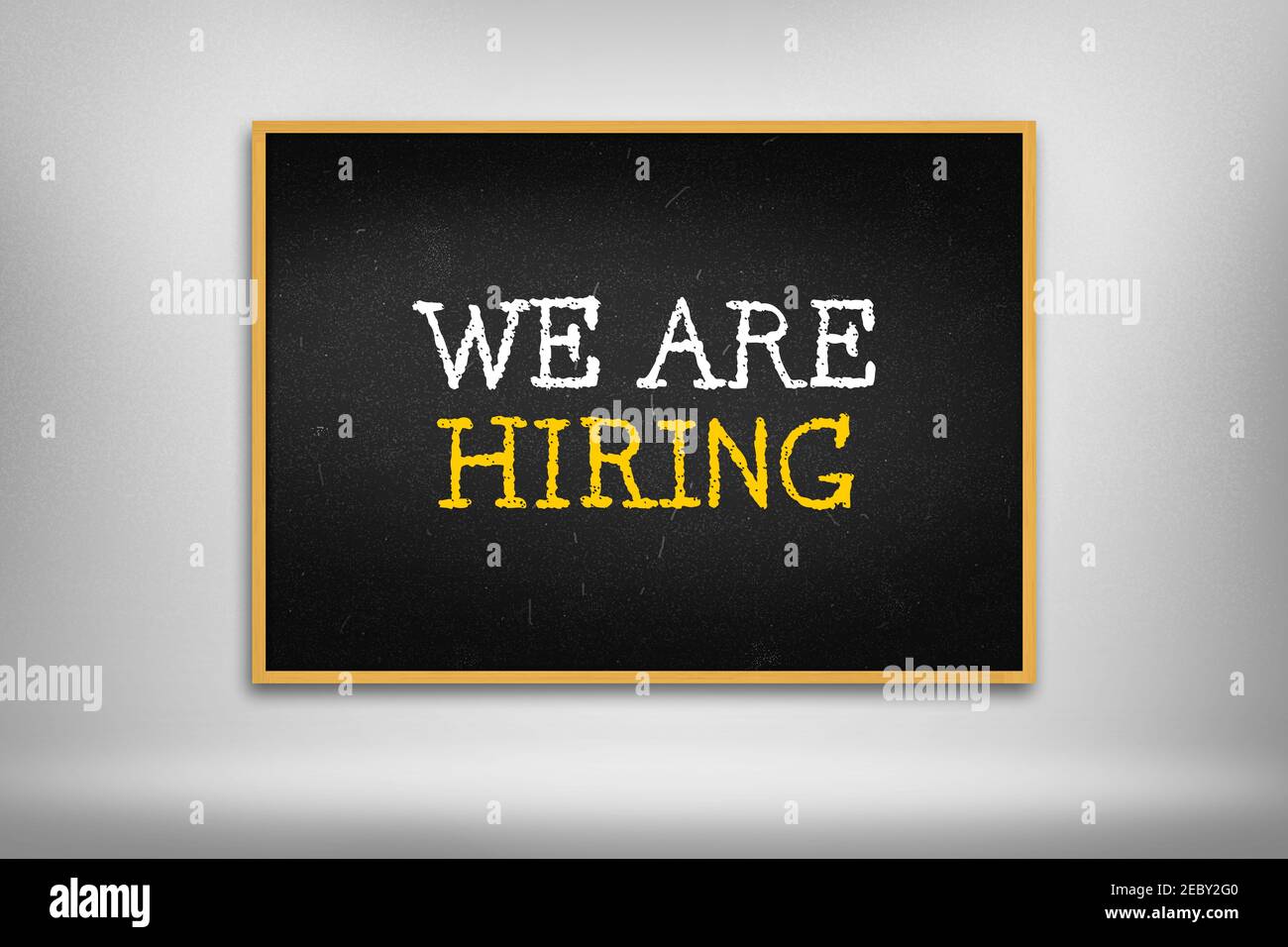 We are Hiring Background written on a black board in a class room ...