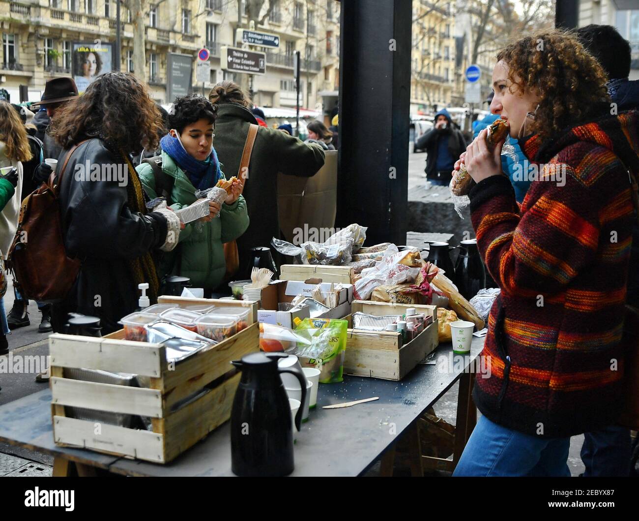 Paris, France. 12th Feb, 2021. Students receive food and fruits at a ...