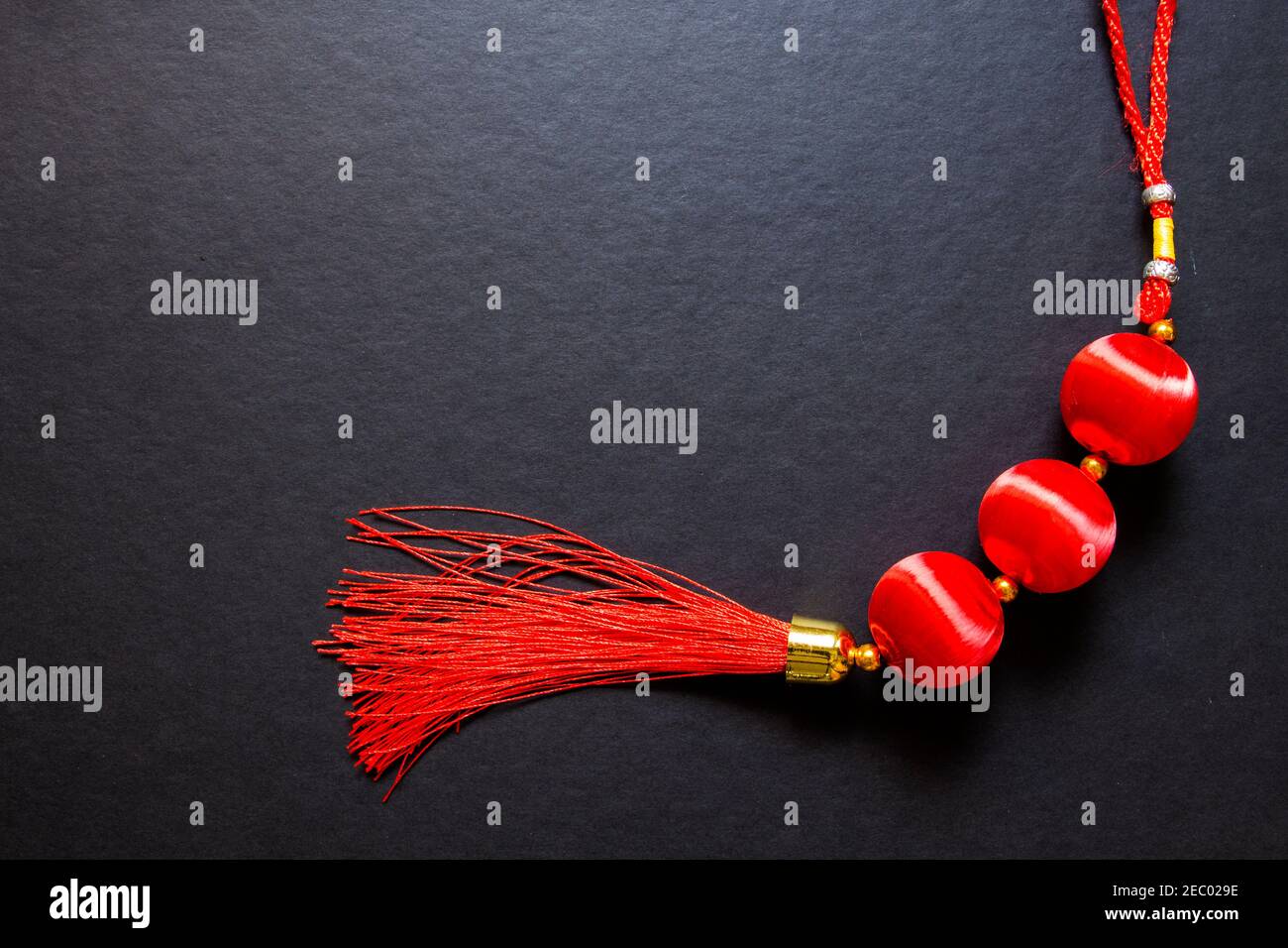 Chinese Lucky knot on black background. Chinese New Year decor top view ...