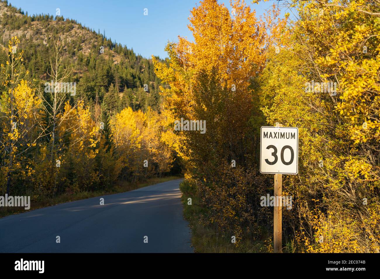 Maximum 30 km speed limit sign in Vermilion Lakes road in autumn ...