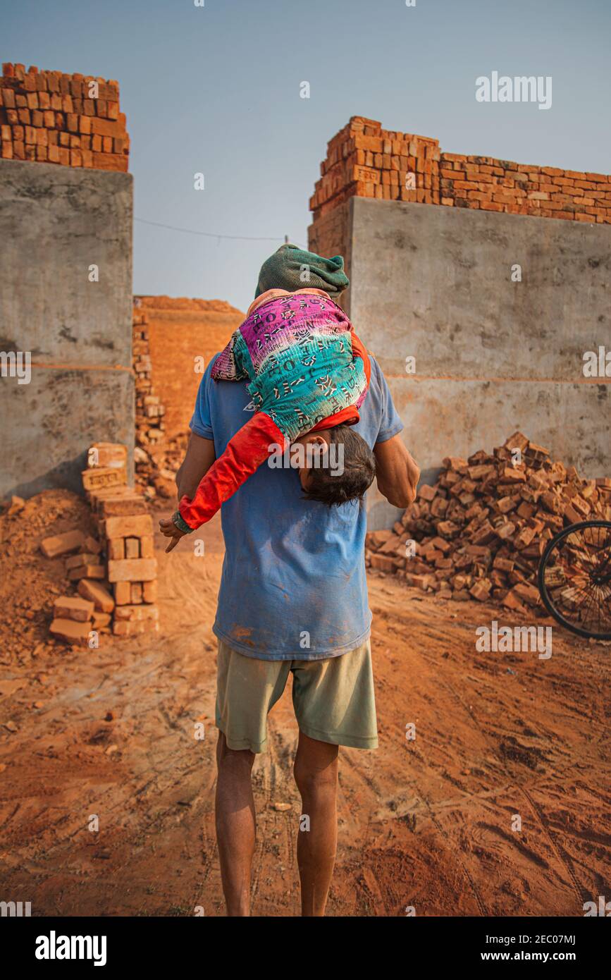 The child is playing in the brick With his father Stock Photo - Alamy