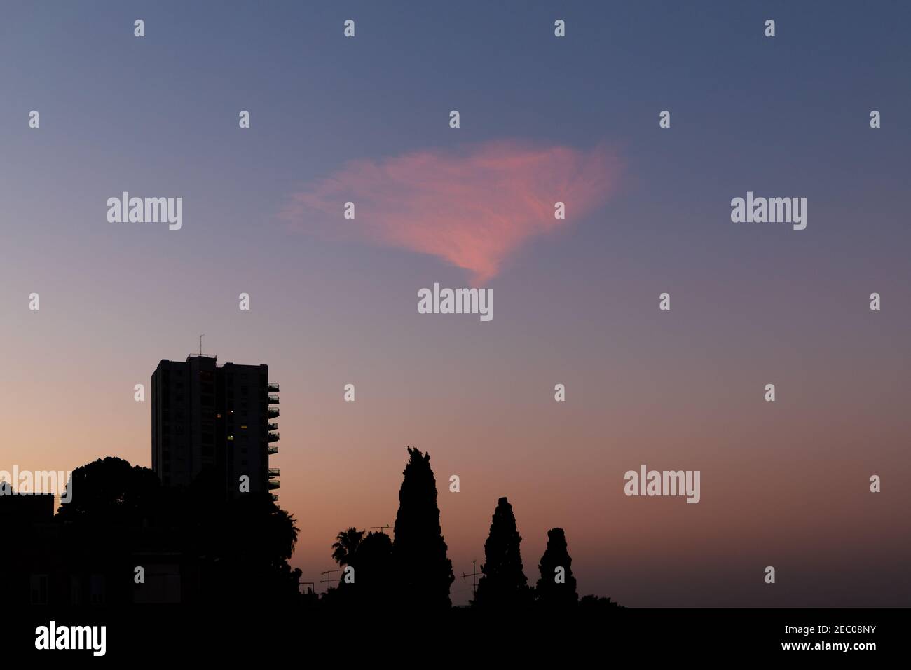 View from the window of a skyscraper, cityscape and evening setting sun ...