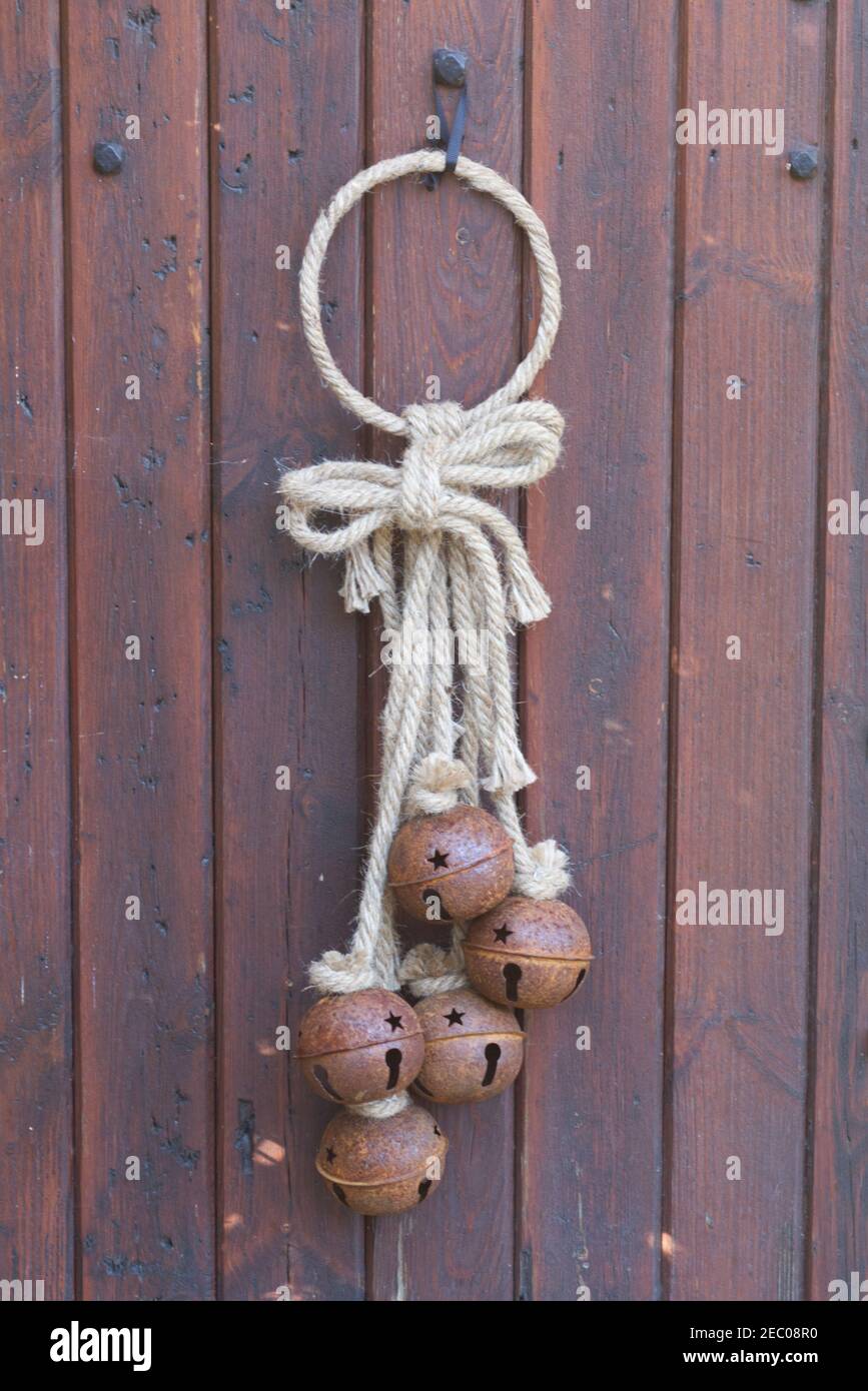 Christmas balls on string hanging on a front door Stock Photo - Alamy