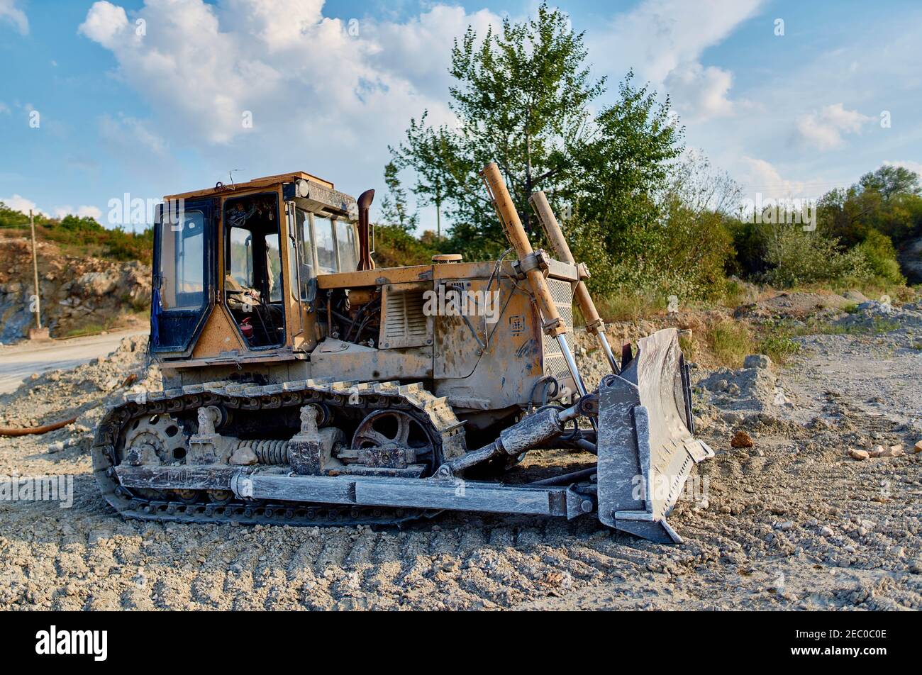 large bulldozer digging earth gravel and geology vehicle Stock Photo ...