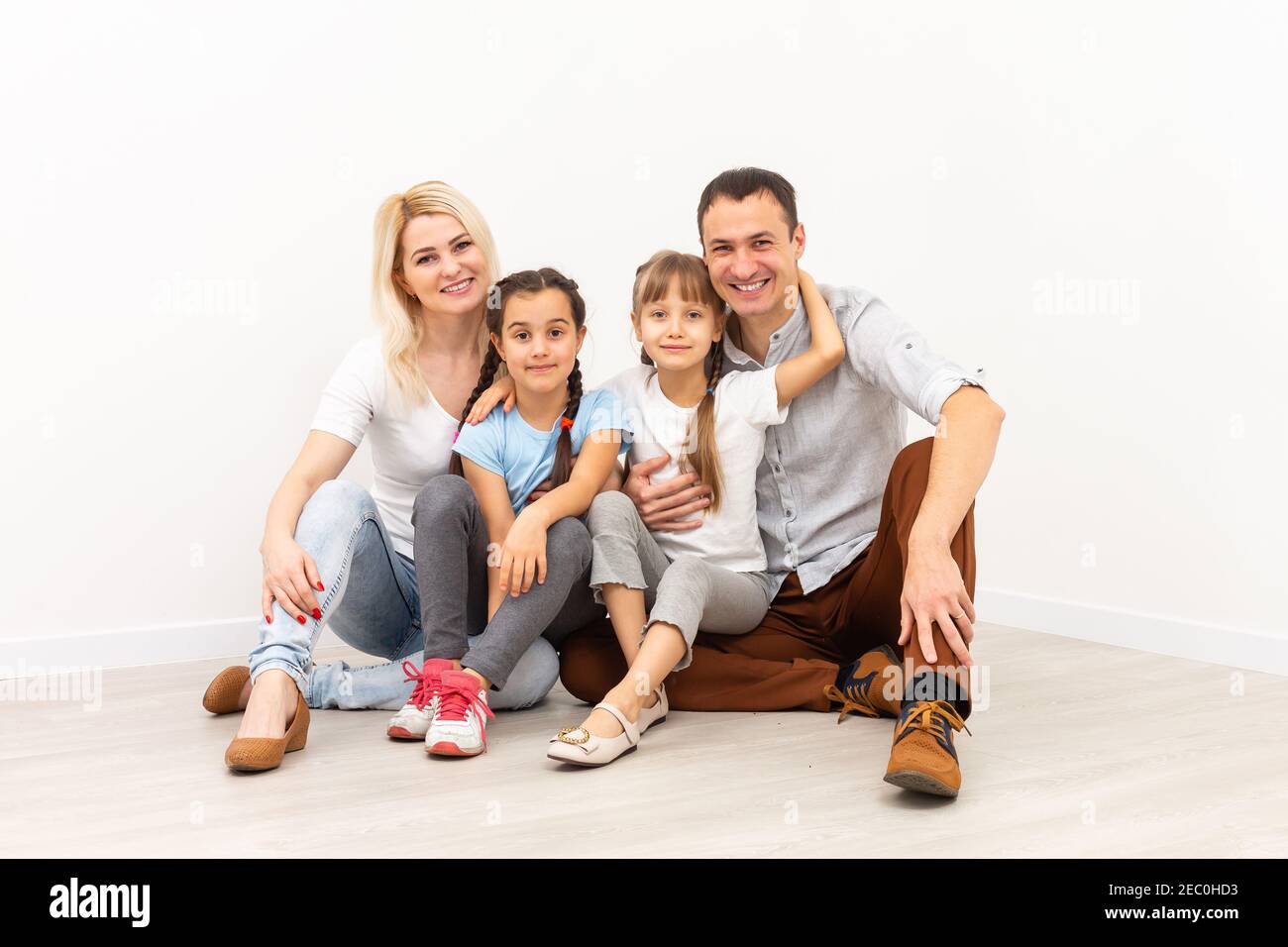 Smiling young parents and their children are very happy, they are at ...