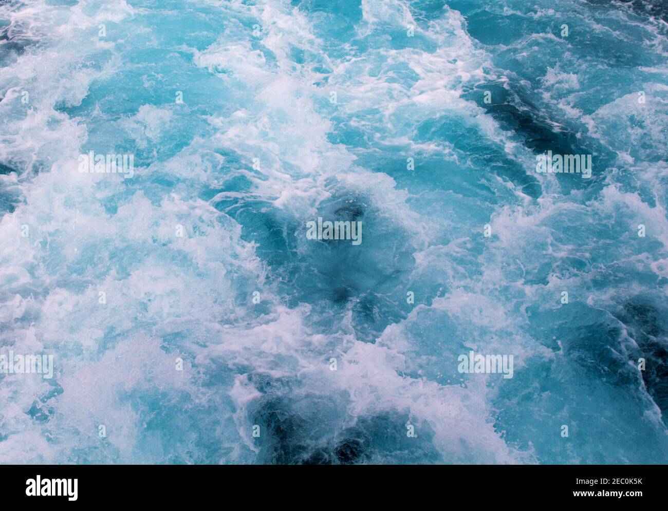 Blue water ship trail with foamy wave. Tropical islands ferry travel ...