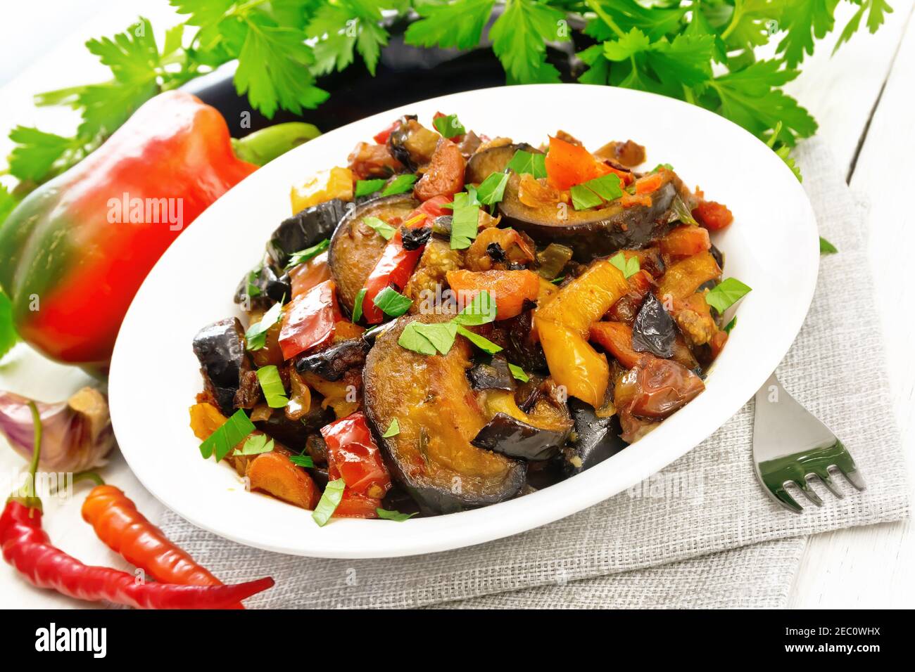 Vegetable ragout with eggplant, tomatoes, sweet and hot peppers, onions ...