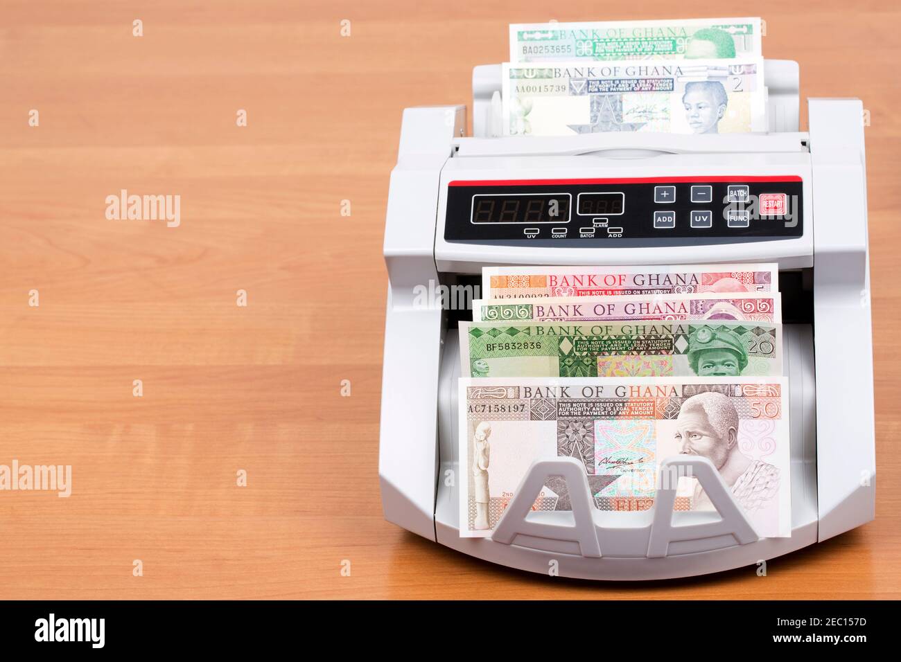 Old Ghanaian money in the counting machine Stock Photo - Alamy