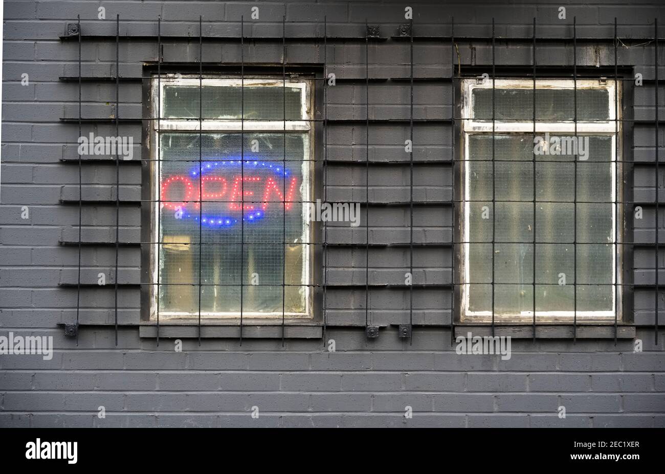 Illuminated red open sign on shop window Stock Photo - Alamy