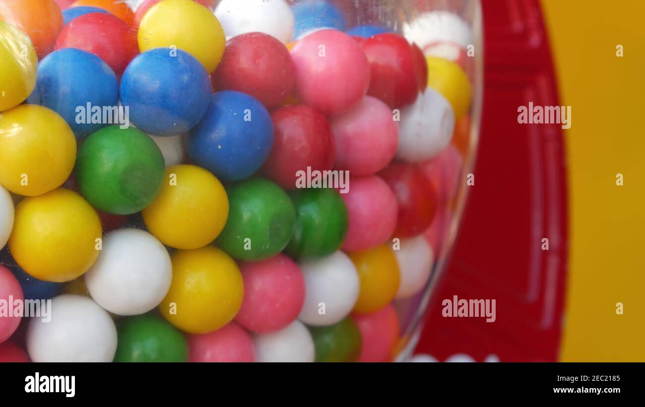 Colorful gumballs in classic vending machine, USA. Multi colored buble ...