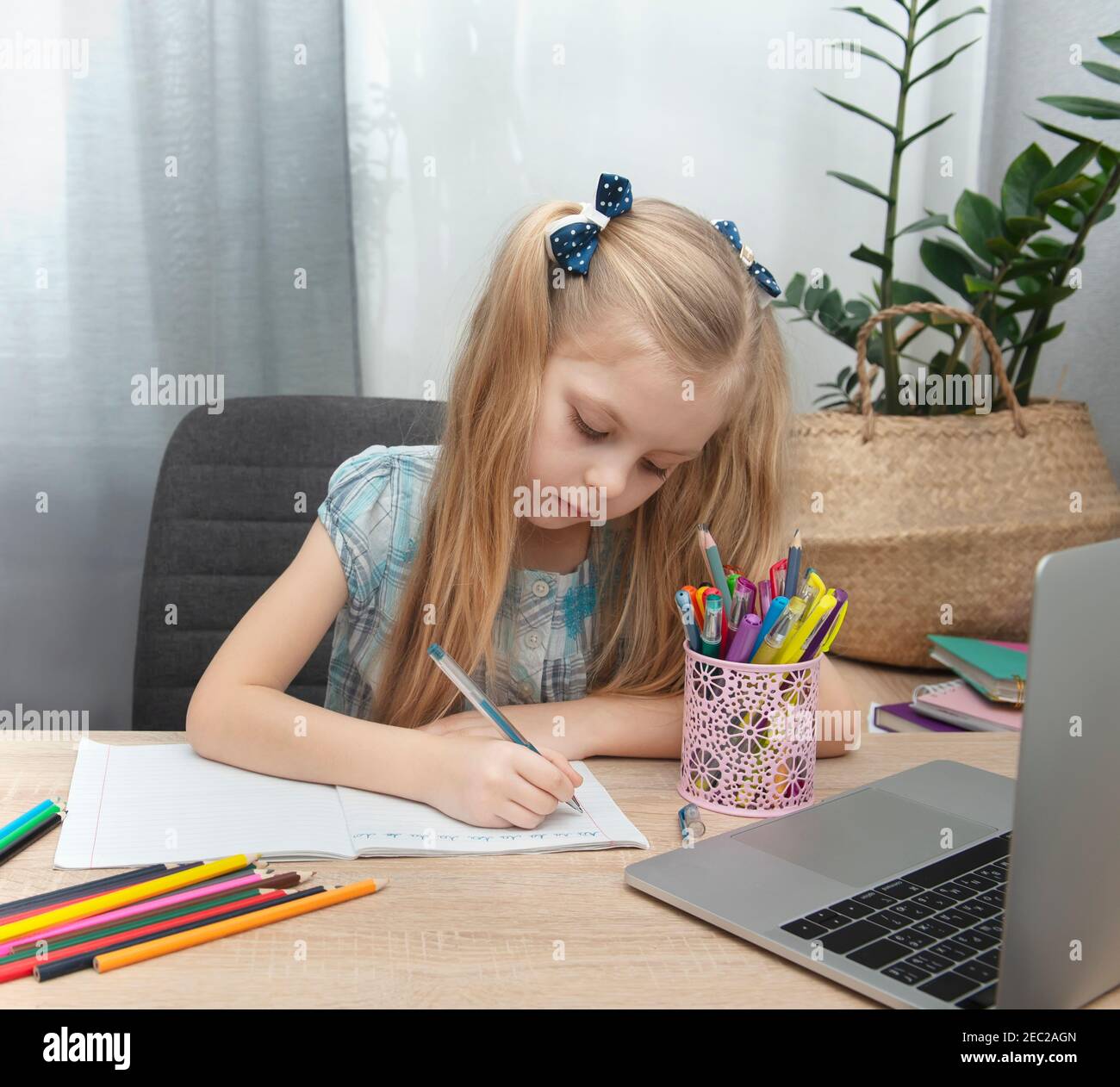 Cute girl doing homework in her room at home Stock Photo - Alamy