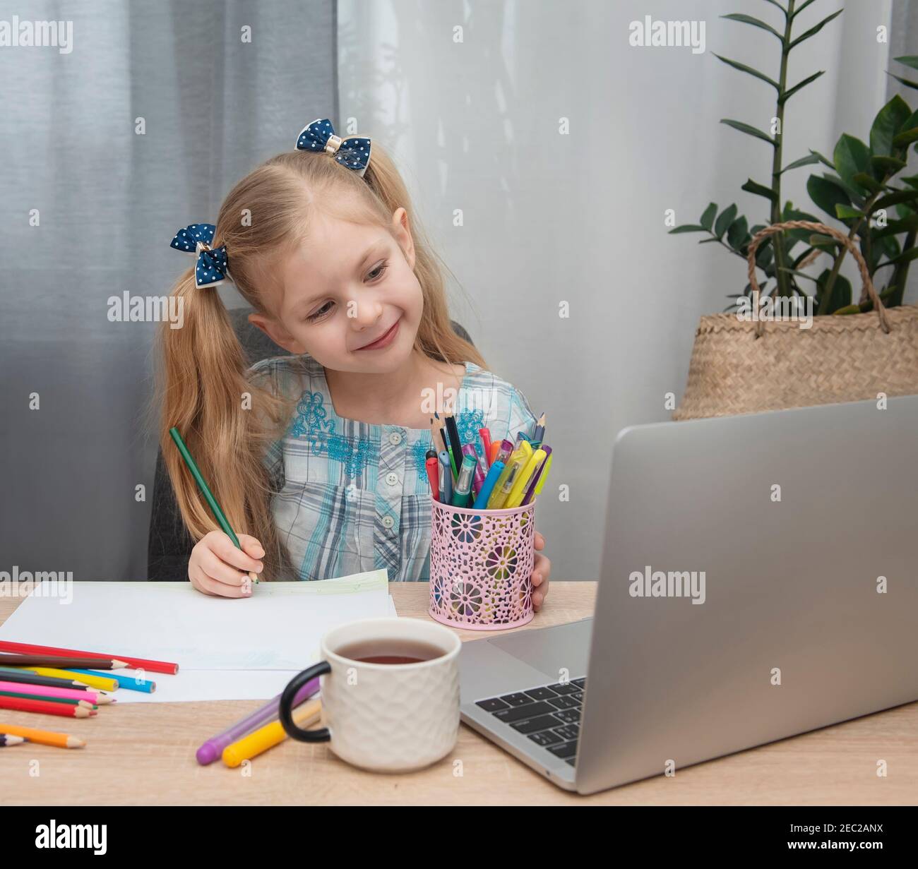 Cute girl doing homework in her room at home Stock Photo - Alamy